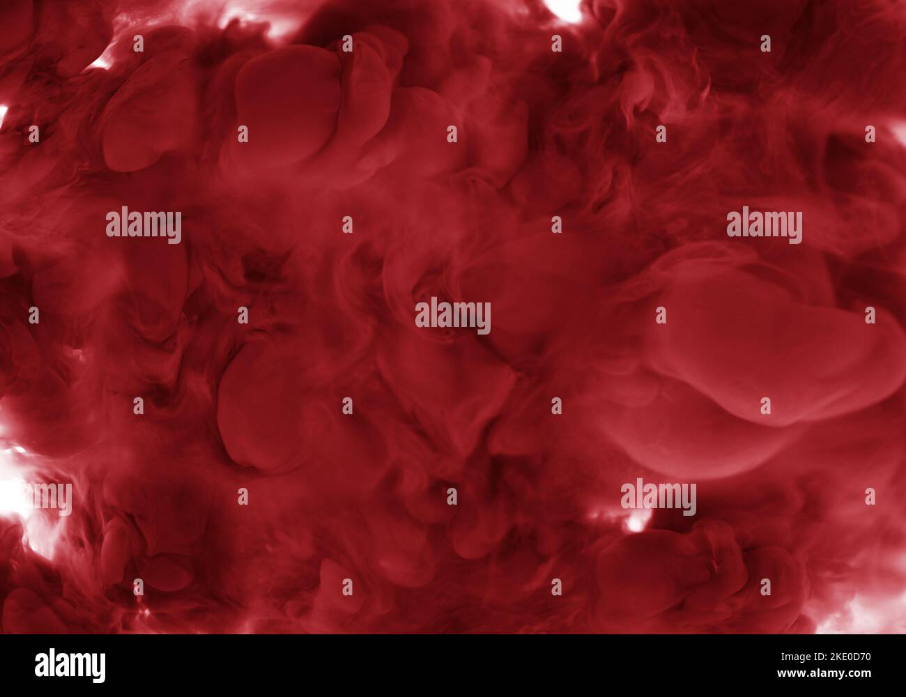 A smoke like shot of red ink in water for cool background Stock Photo ...