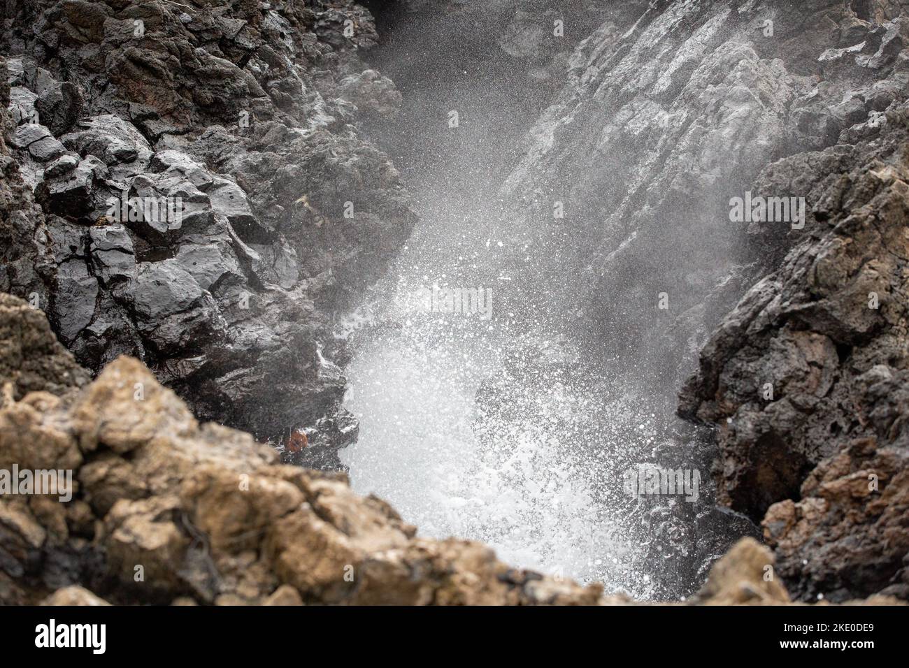 The ocean wave crashing into the rocks and splashing Stock Photo - Alamy