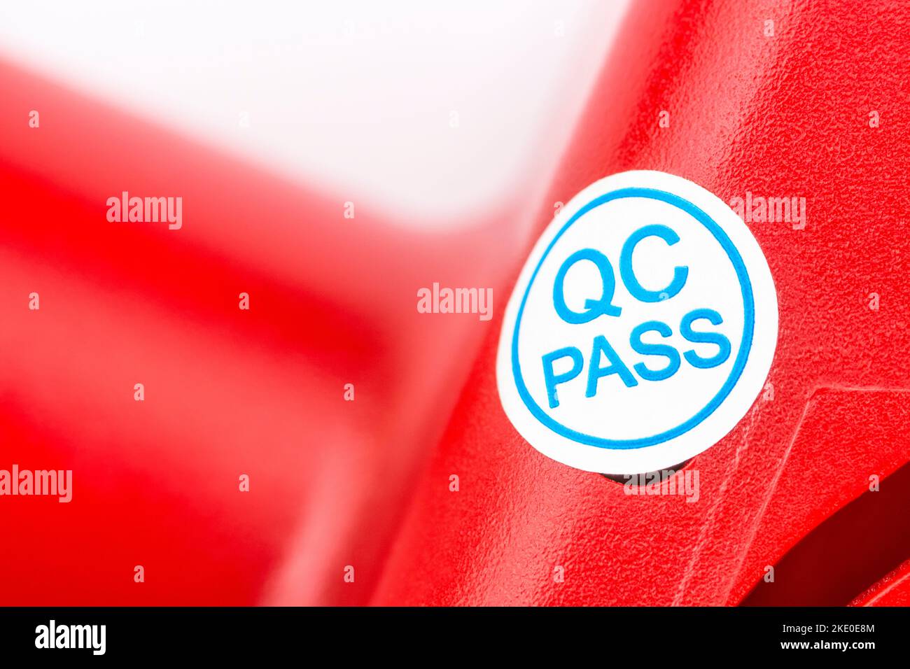 Close-up of blue and white paper QC Pass sticky paper label on side of ...