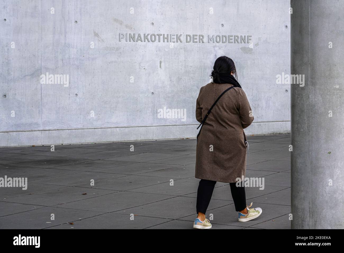 A woman walks in front of the Museum Pinakothek der Moderne in Munich ...