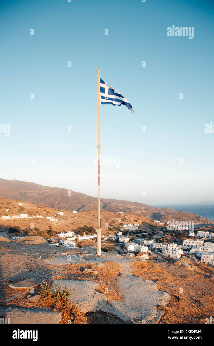 An aerial, vertical view of a Greek flag on a hill over looking the ...