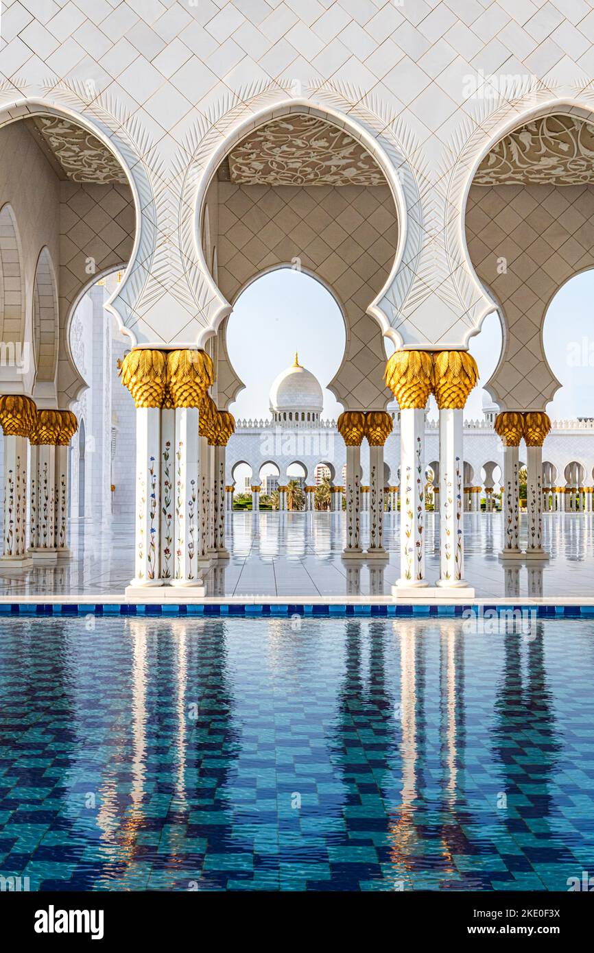 Marble and gold domes at the reflective pool at Sheikh Zayed Grand ...