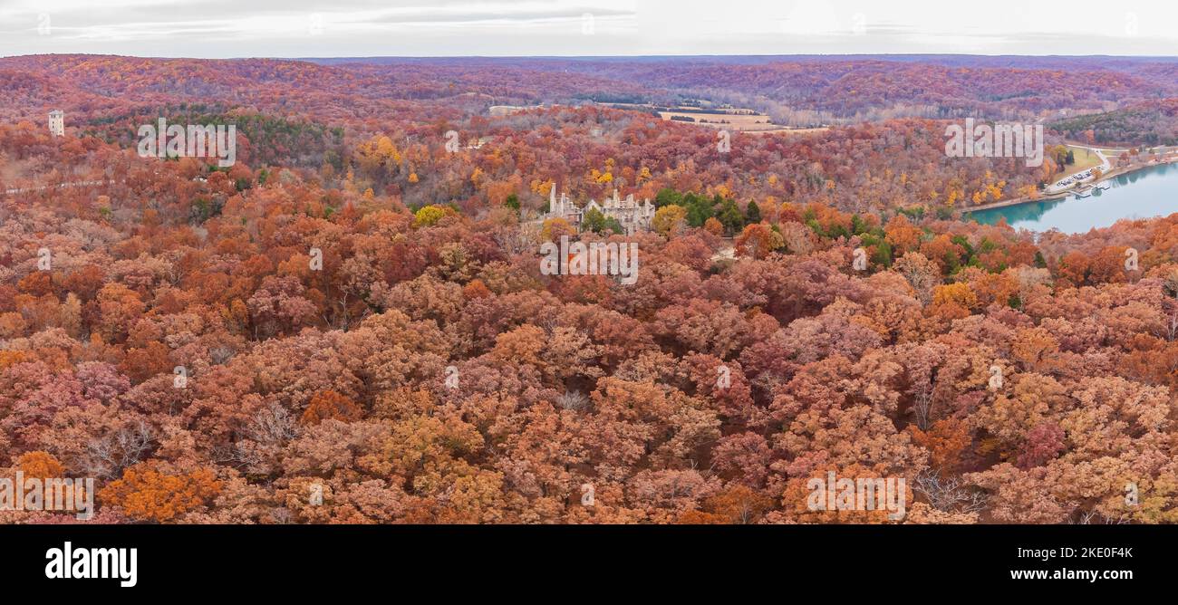 Aerial view of the fall color of Lake Ozark and the castle ruins at ...