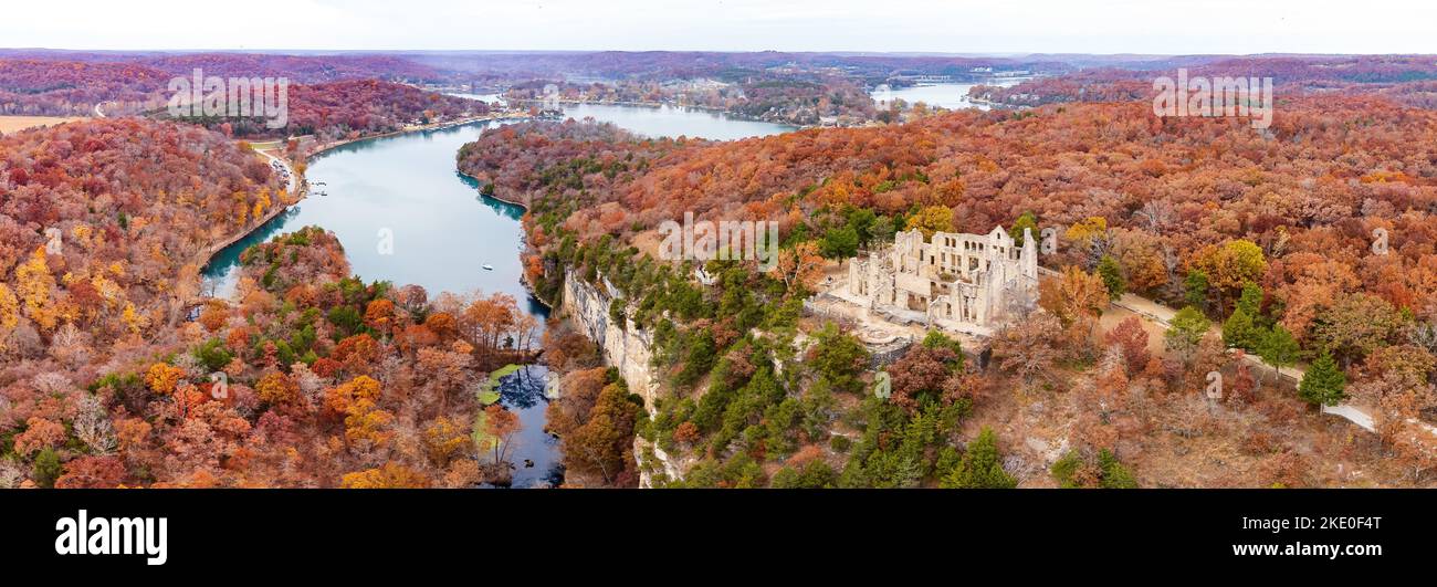 Aerial view of the fall color of Lake Ozark and the castle ruins at ...