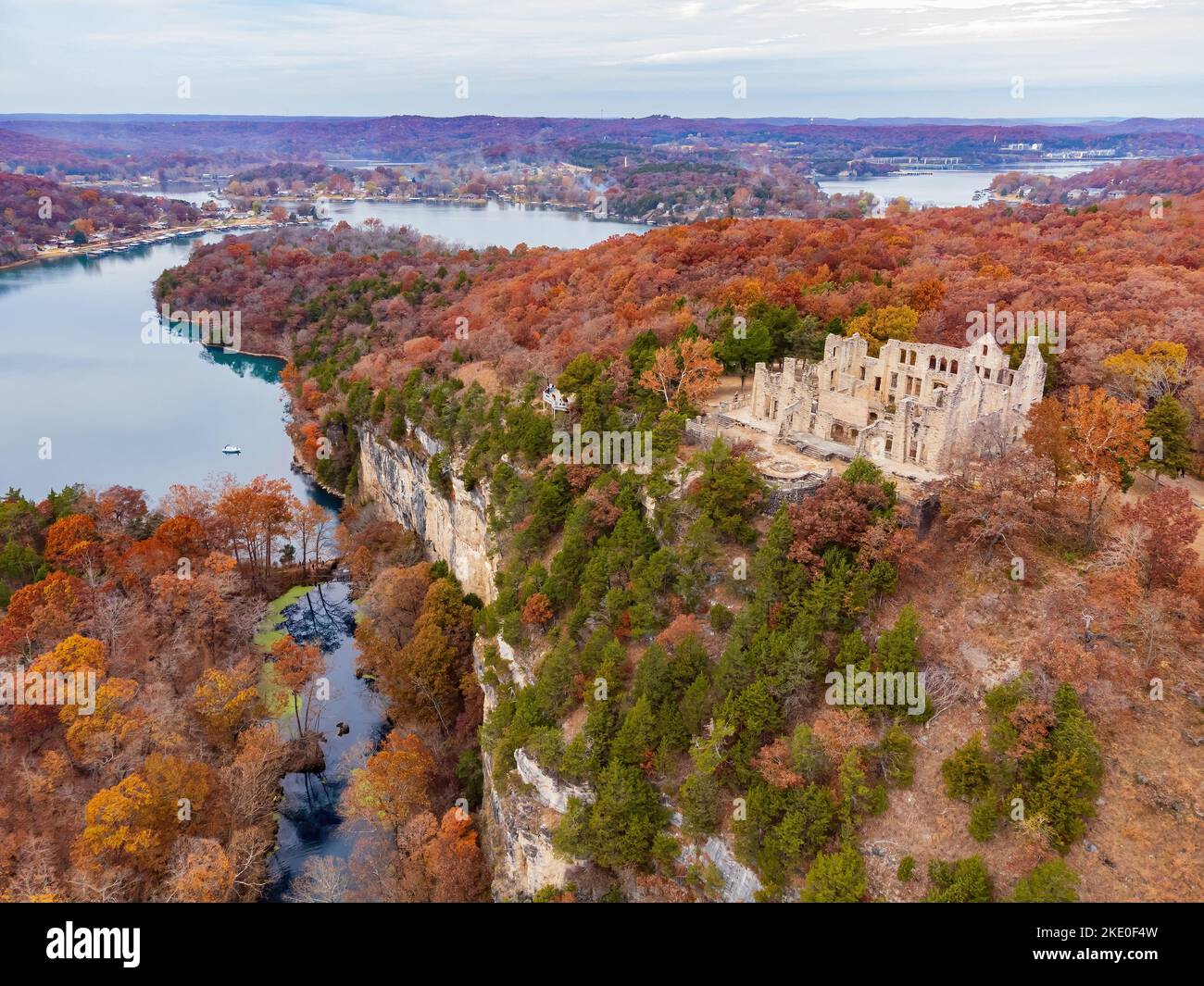 Aerial view of the fall color of Lake Ozark and the castle ruins at ...