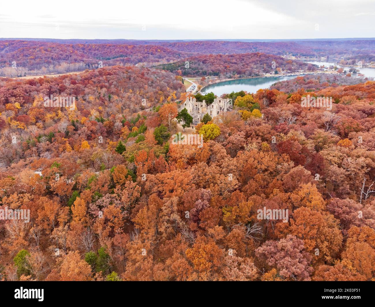 Aerial view of the fall color of Lake Ozark and the castle ruins at ...