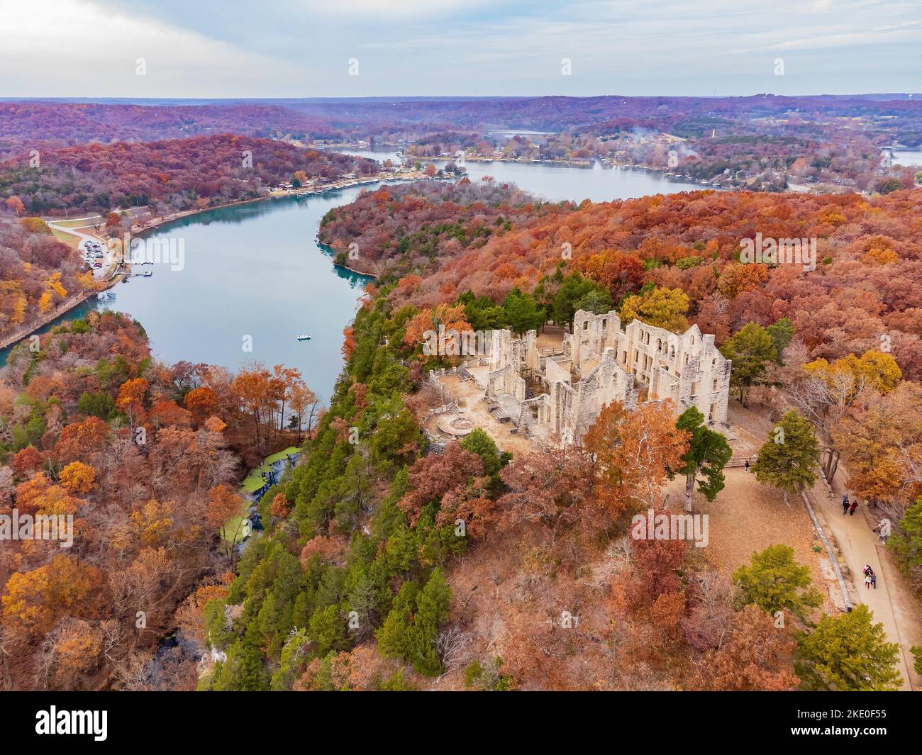 Aerial view of the fall color of Lake Ozark and the castle ruins at ...