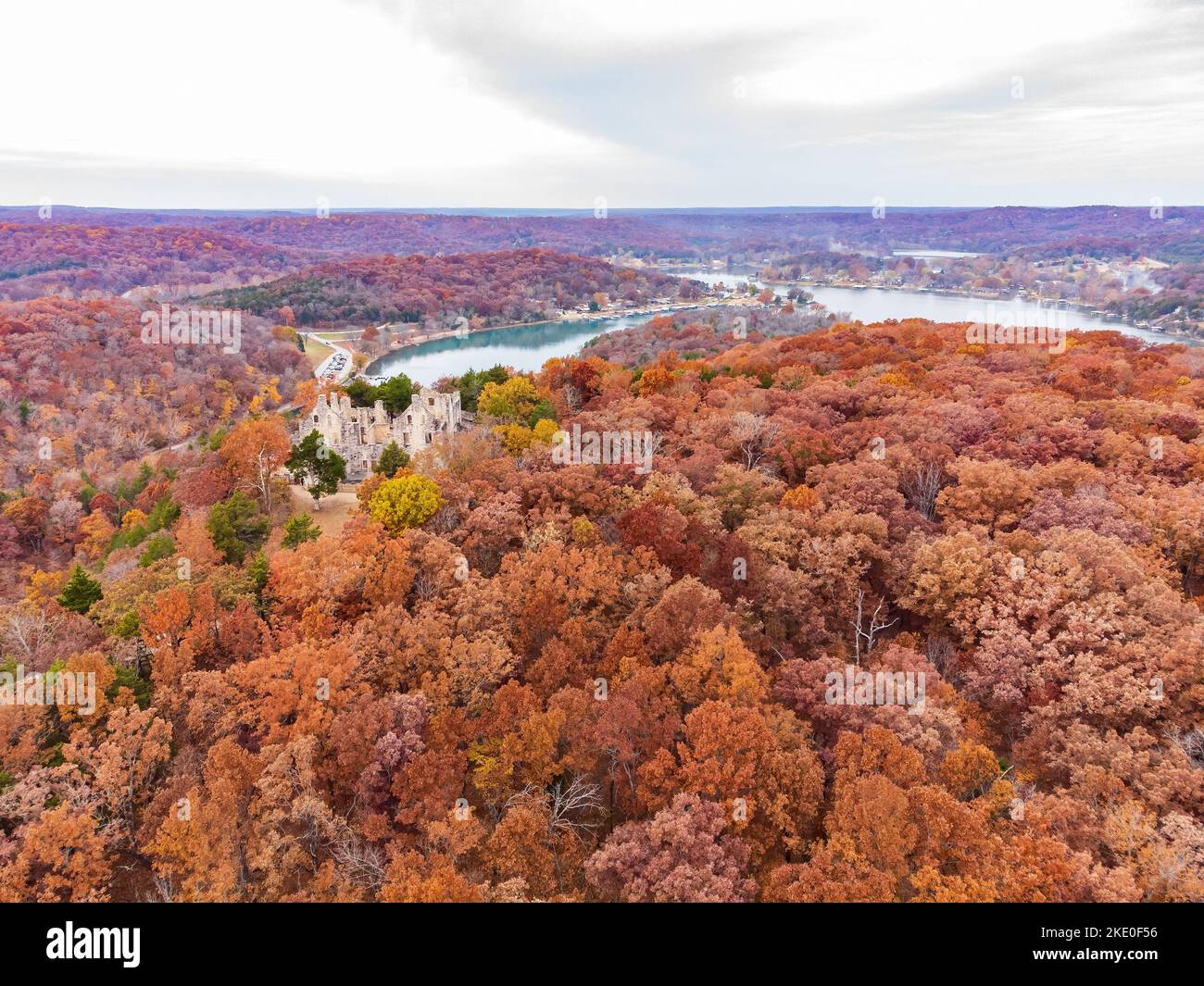 Aerial view of the fall color of Lake Ozark and the castle ruins at ...