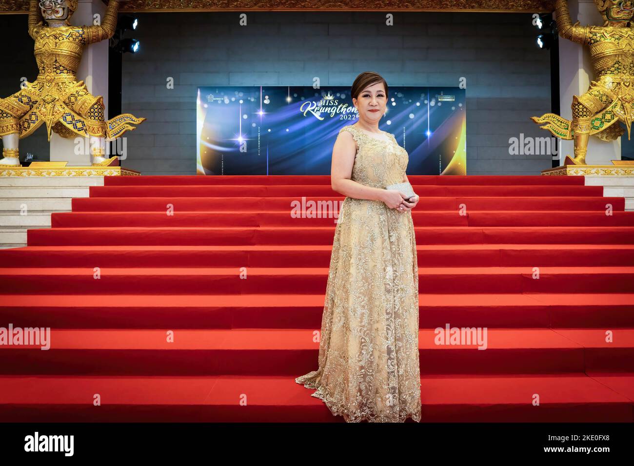 A sponsor poses for a photo on the red carpet outside of the Aksra ...