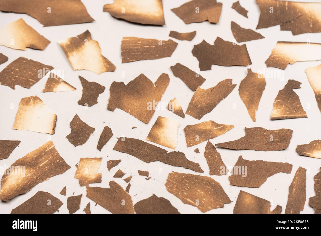 Burnt paper isolated on a white background. Copy space Stock Photo - Alamy