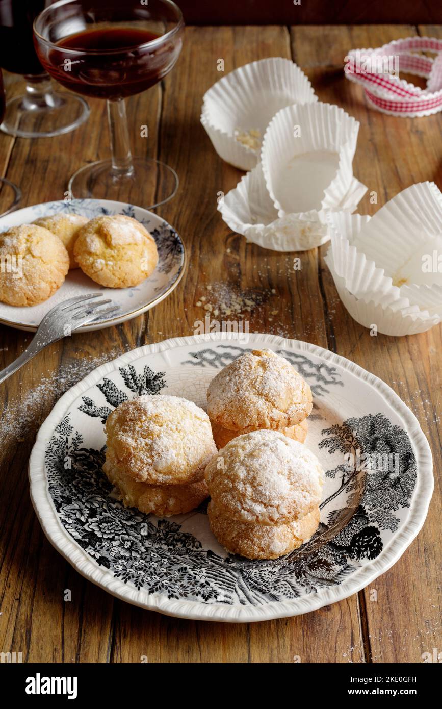 Christmas biscuits, and some glass of wine on wooden table. Front view ...