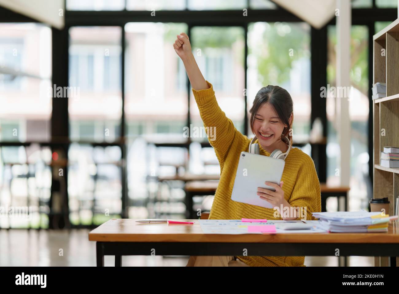 Attractive female student learning language, watching online webinar ...