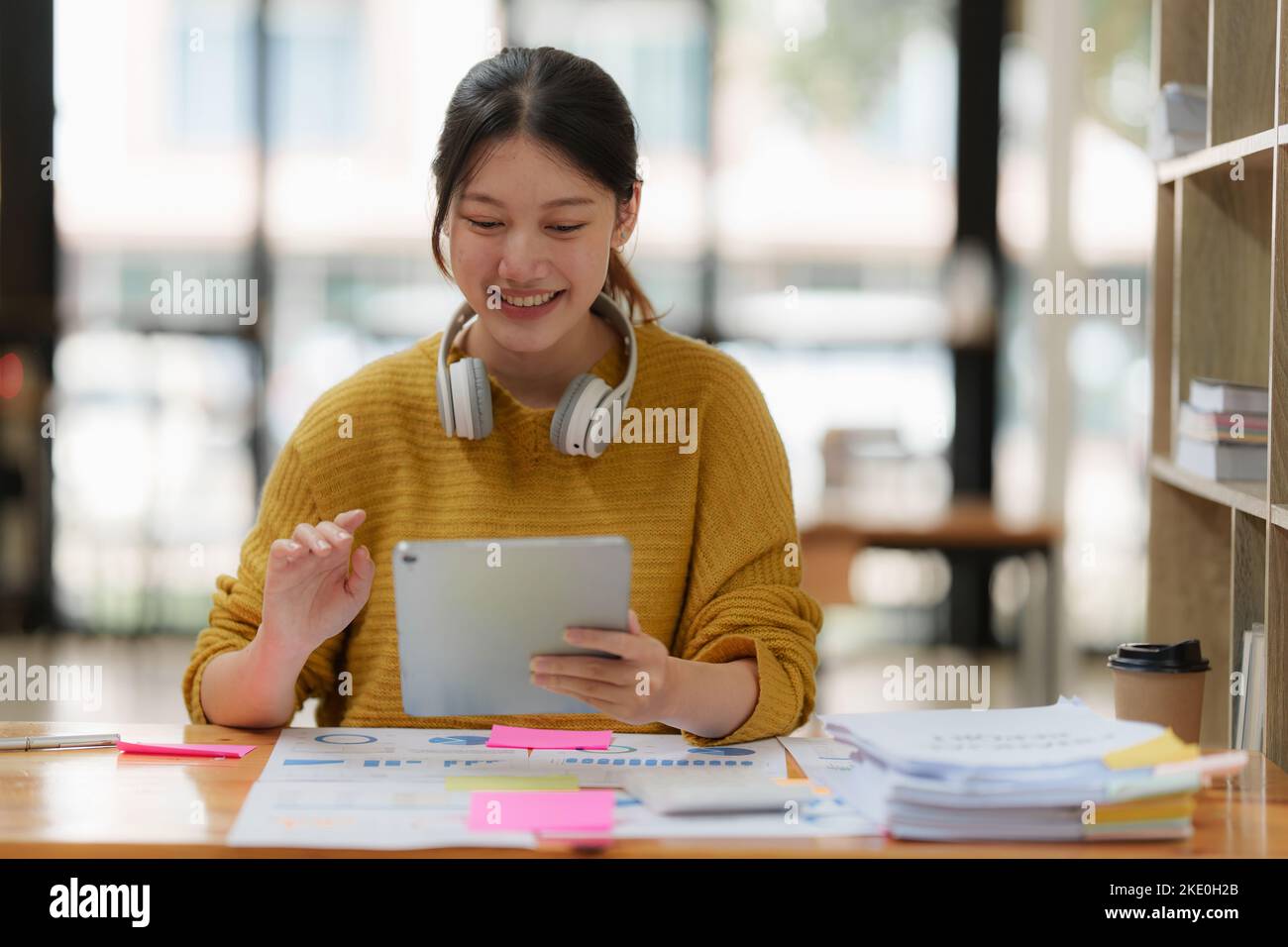 Attractive female student learning language, watching online webinar ...