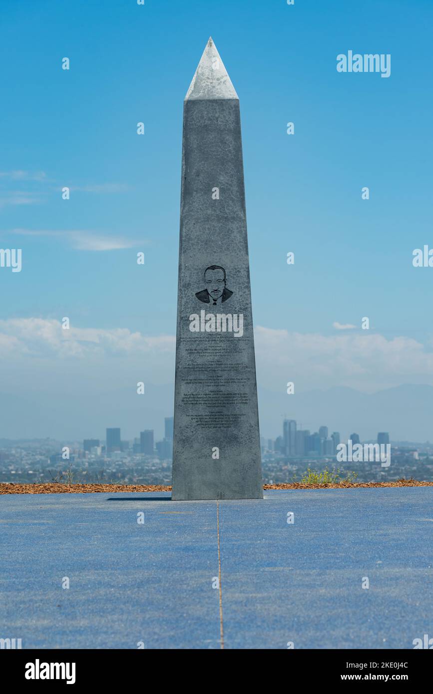 A vertical shot of the Martin Luther King monument with the background ...