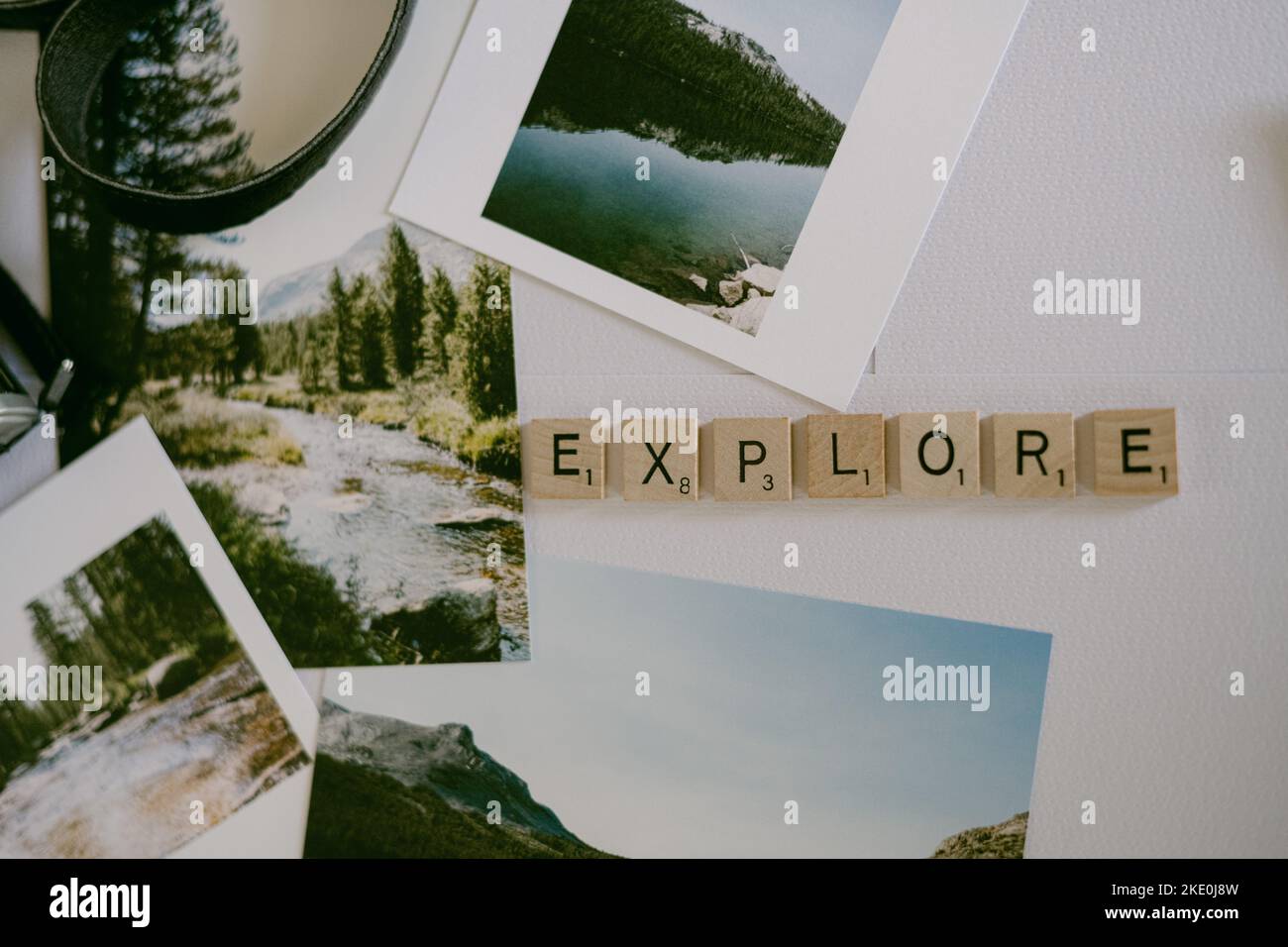 A top view of an Instant camera and photo prints, a concept of explore ...