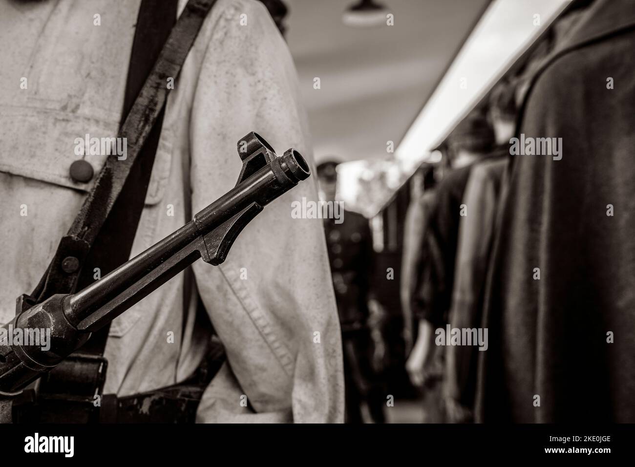 Close-up of german soldier with rifle in hand during deportation of ...