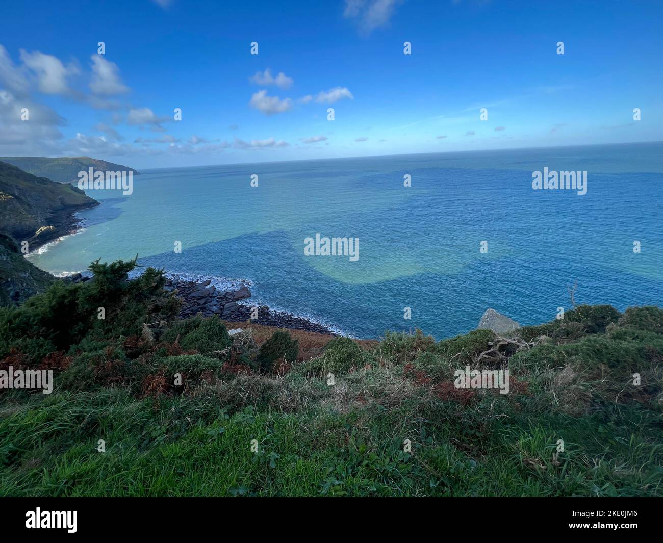 The view of the waterside cliffs under the blue sky in Lynton and ...