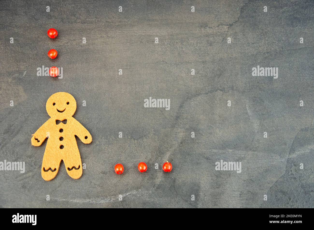 Christmas rustic background with berries and Gingerbread man Stock ...