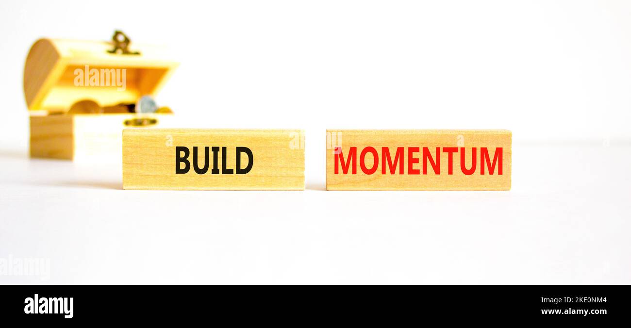 Build momentum symbol. Concept words Build momentum on wooden blocks ...