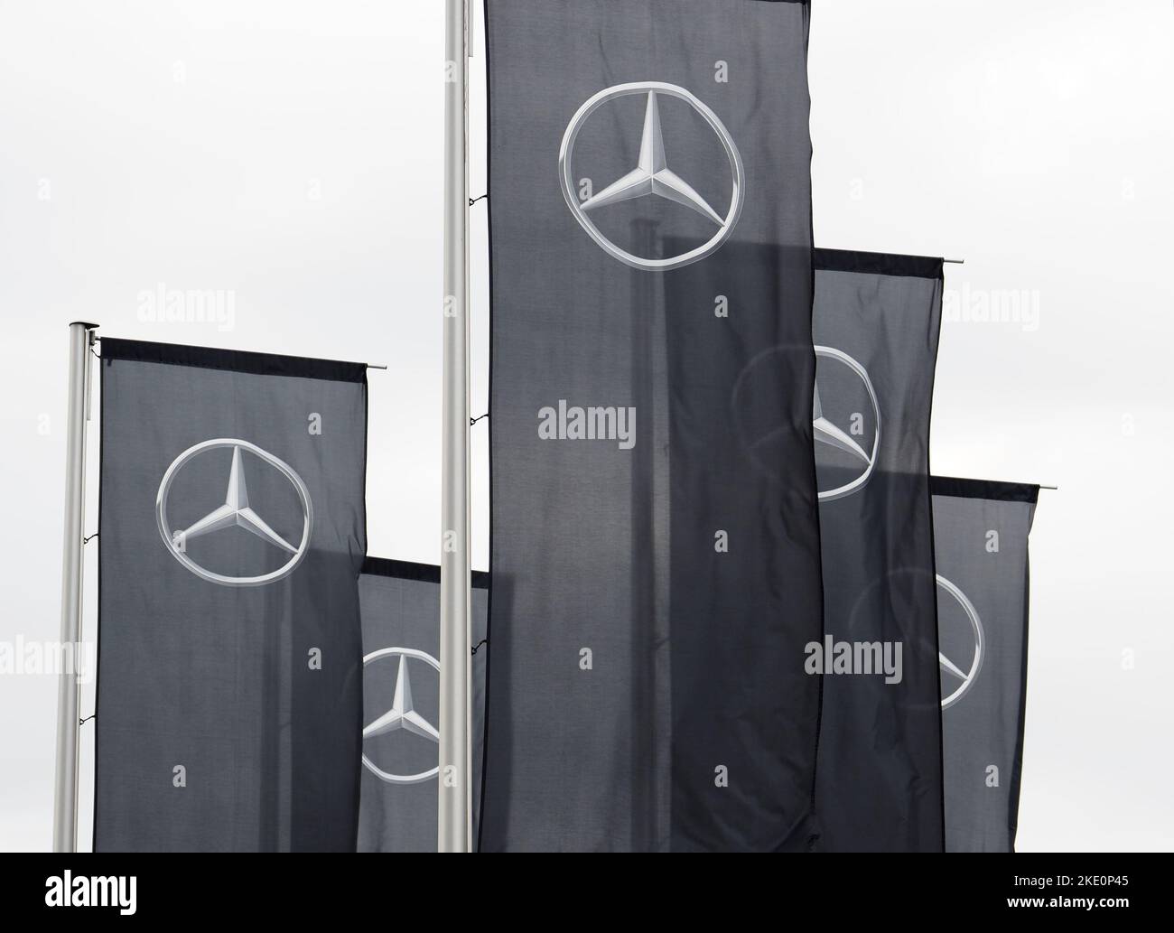 Flags with the Mercedes-Benz logo are seen in front of the Mercedes ...