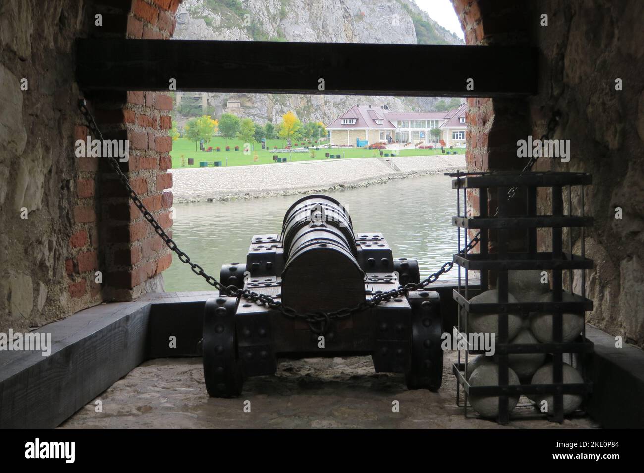 An old canon at the window of a medieval castle Stock Photo - Alamy