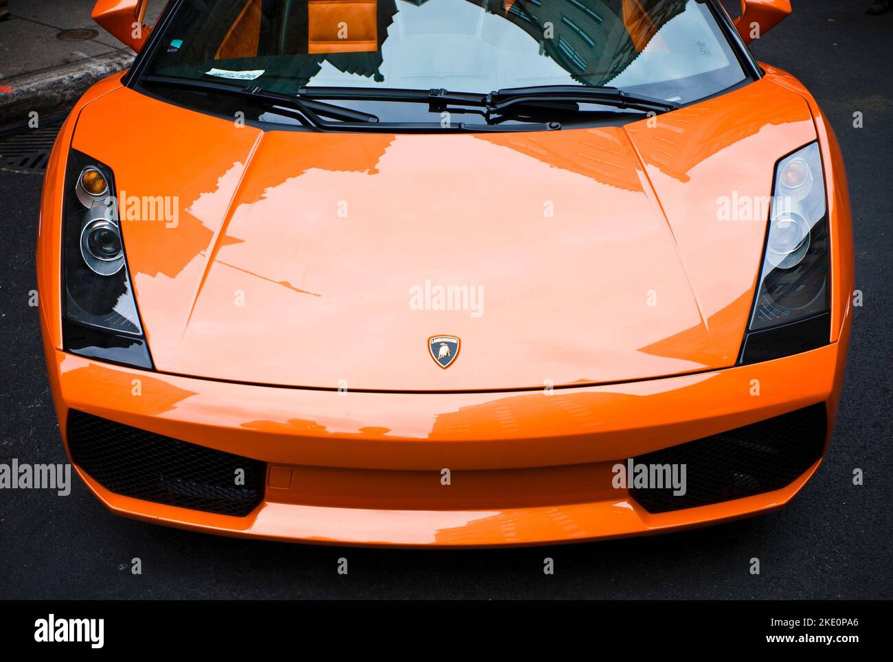 An orange Lamborghini Gallardo 2006 shot from the front in the street ...