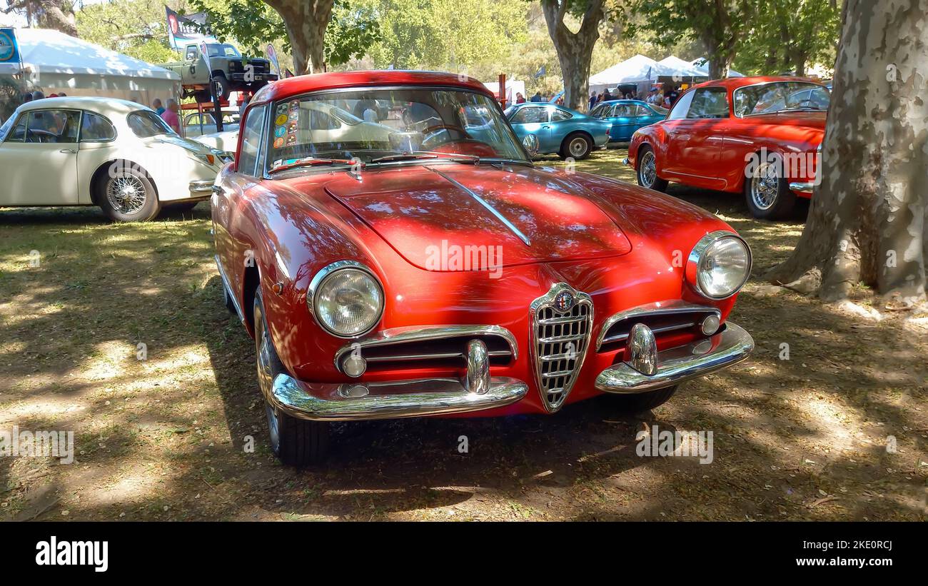 Old red sport 1961 Alfa Romeo Giulietta Spider roadster in a park ...