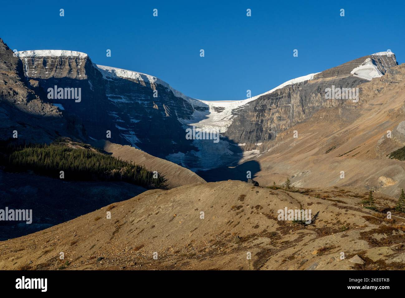 A beautiful shot of rough mountains partly covered in snow in the ...