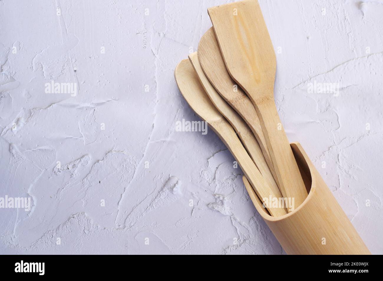 wooden cutlery fork and spoon on a chopping board on table Stock Photo ...