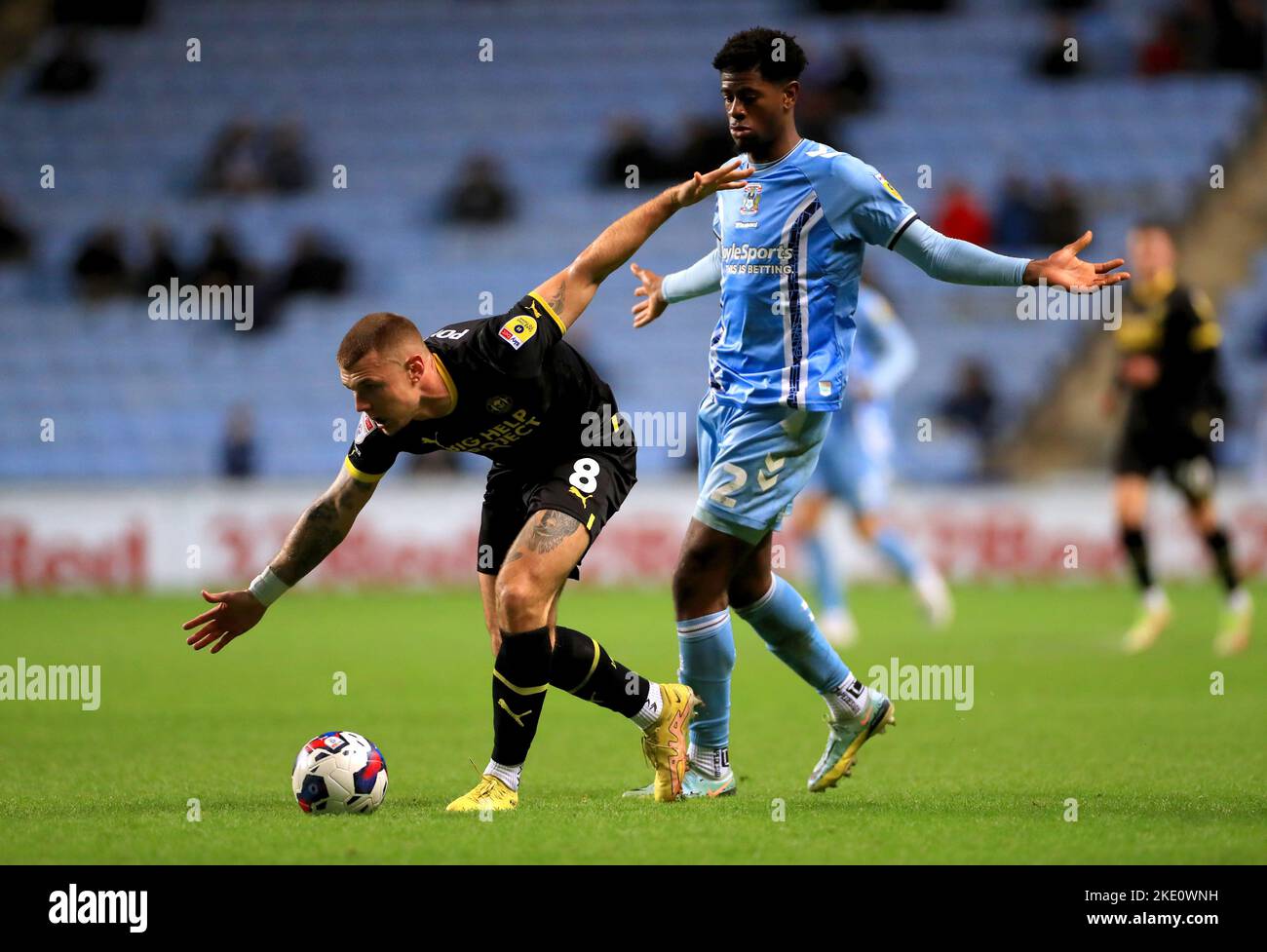 Wigan Athletic's Max Power (left) and Coventry City's Jonathan Panzo ...