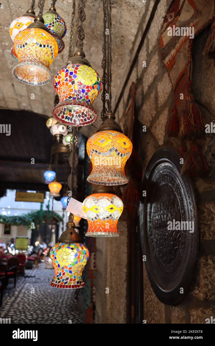 The vertical view of lamps with stained glass designs, hanging by the ...