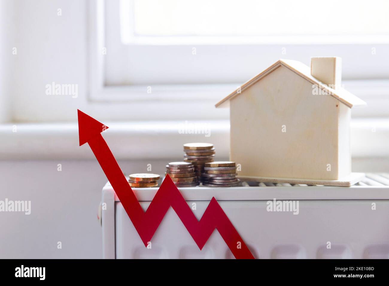 Home heating bills increase. Red up arrow with a house on a heating ...