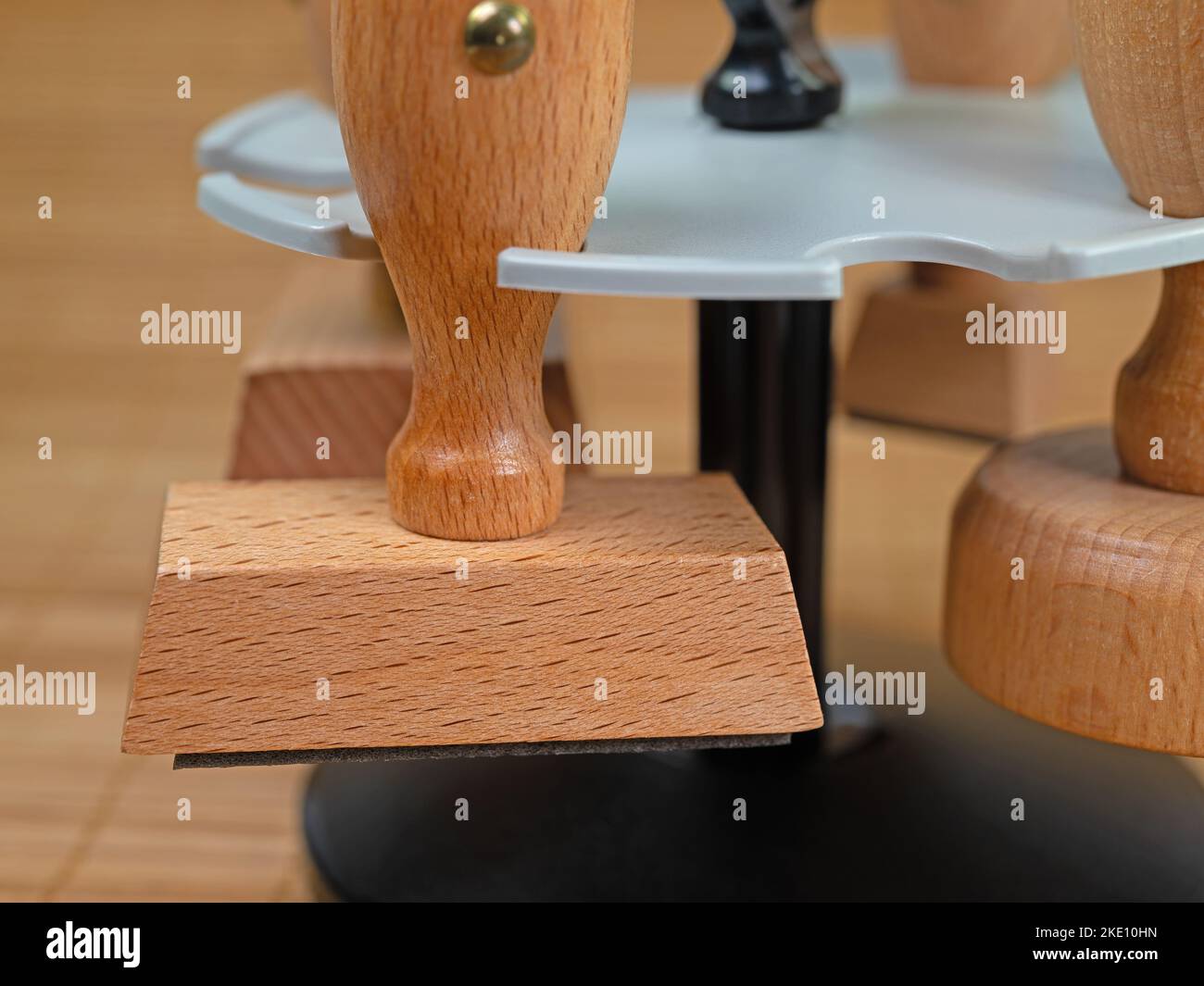 Various wooden stamps in stamp holders Stock Photo - Alamy