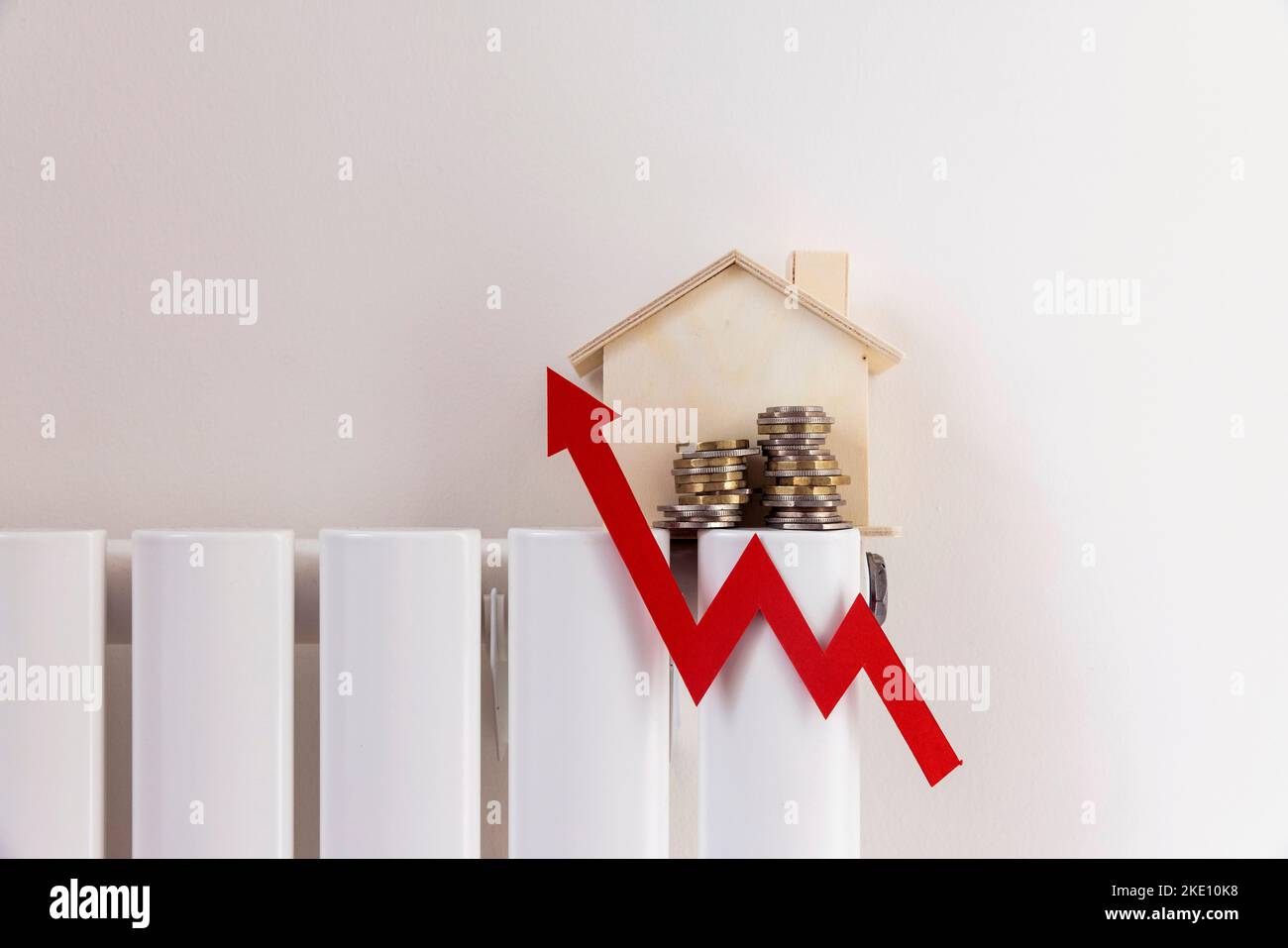 Home heating bills increase. Red up arrow with a house on a heating ...