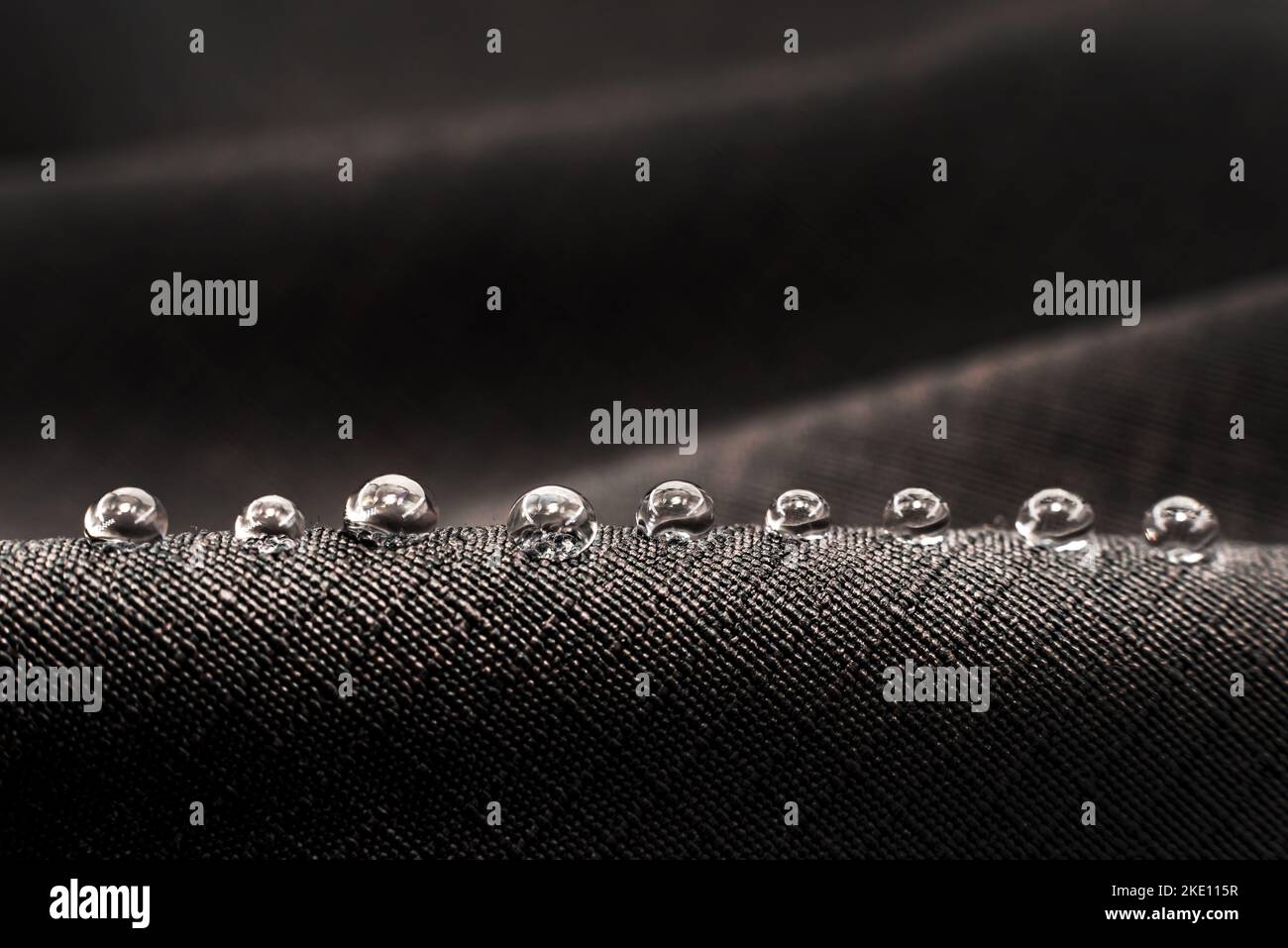 Drops of water on textiles. Waterproof fabric with drops on the surface ...