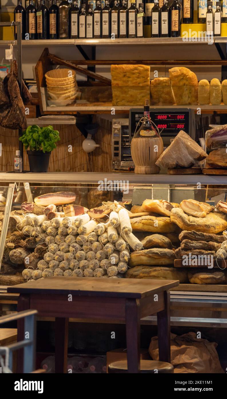 A vertical close-up picture of a small sweet shop with many delicacies ...