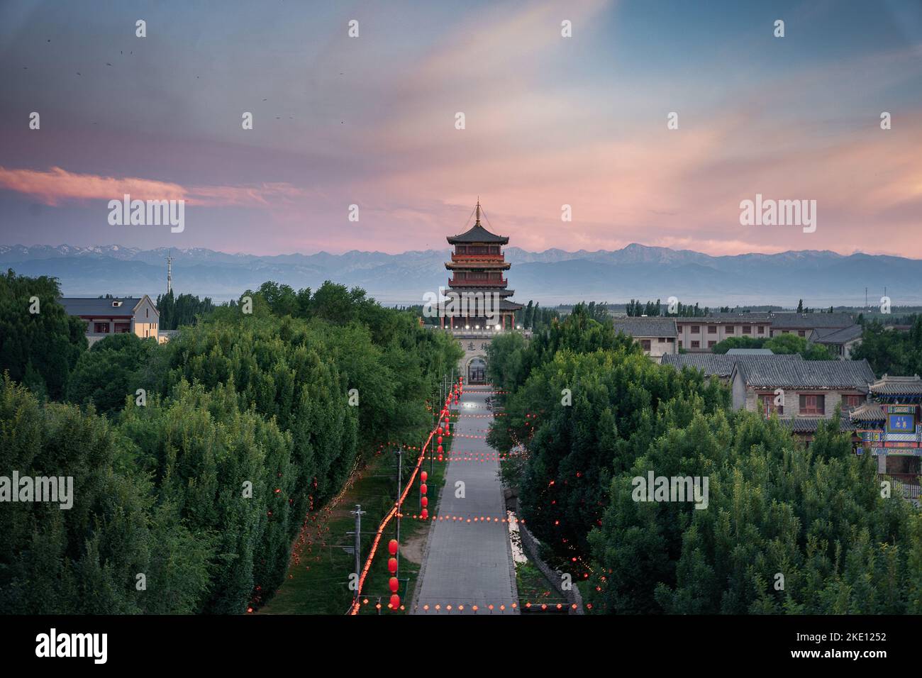 The Pathway Going Towards The Sky Temple With A Sunset Background Stock