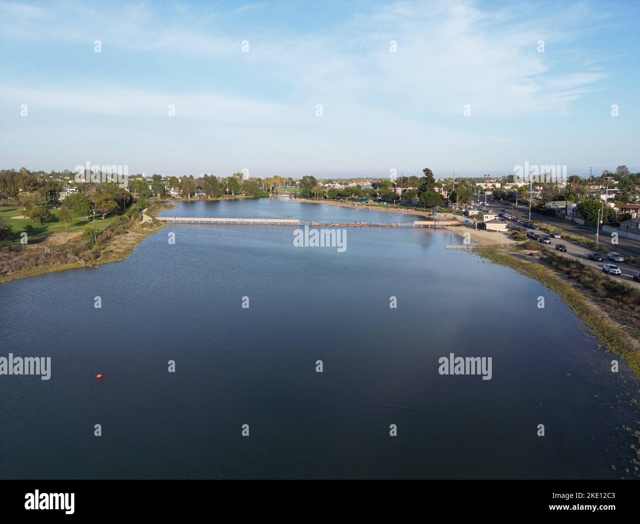 A wide river with a bridge near the buildings Stock Photo - Alamy