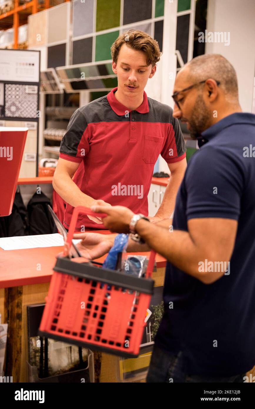 Male cashier hi-res stock photography and images - Alamy