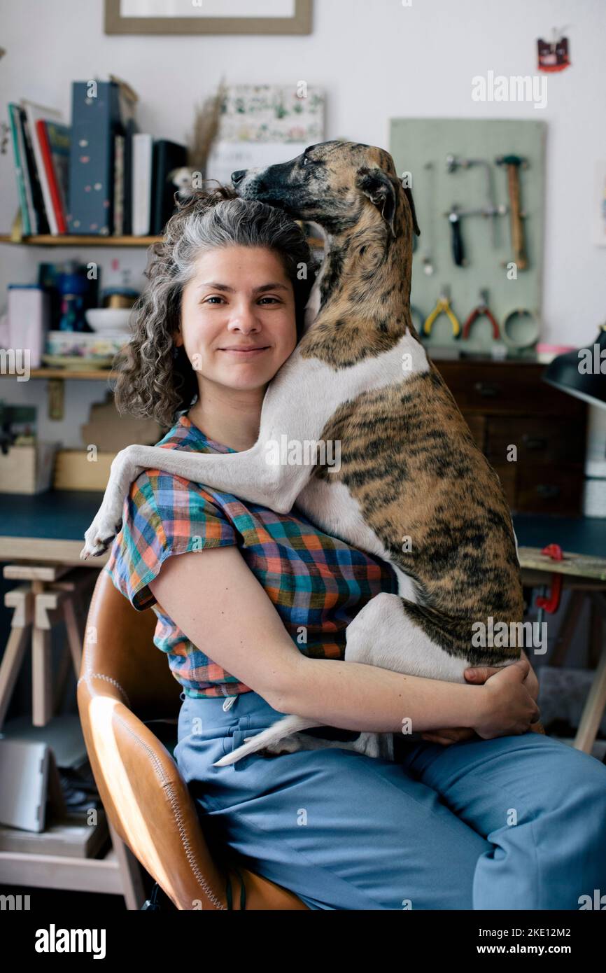 Dog sitting on chair hi-res stock photography and images - Alamy