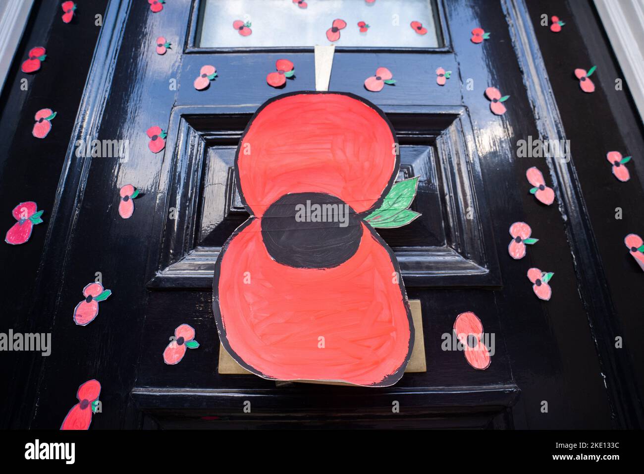 9 November 2022. House door decorated with remembrance poppies, London ...