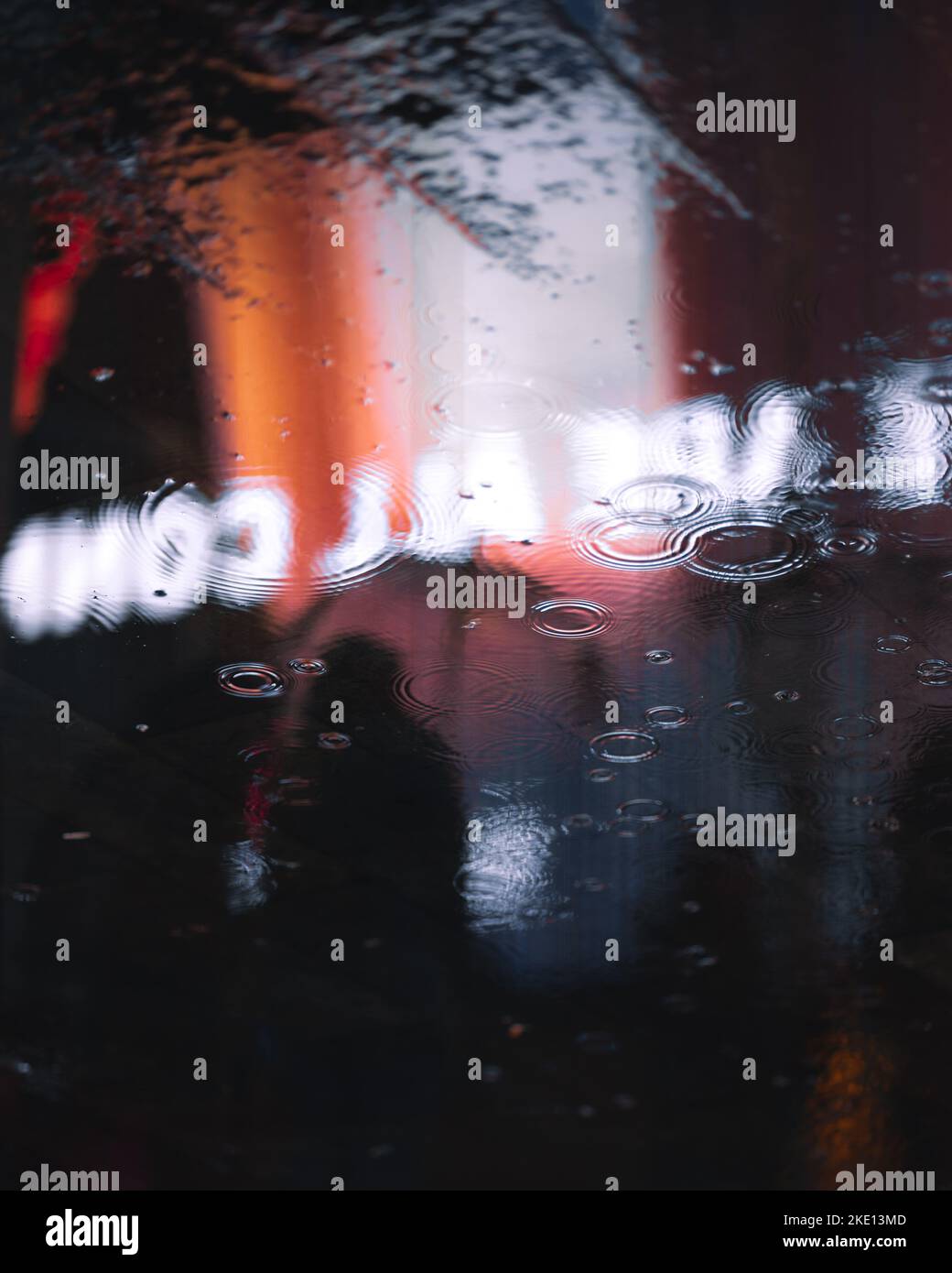 A puddle of water on the floor at times square in new york reflecting ...