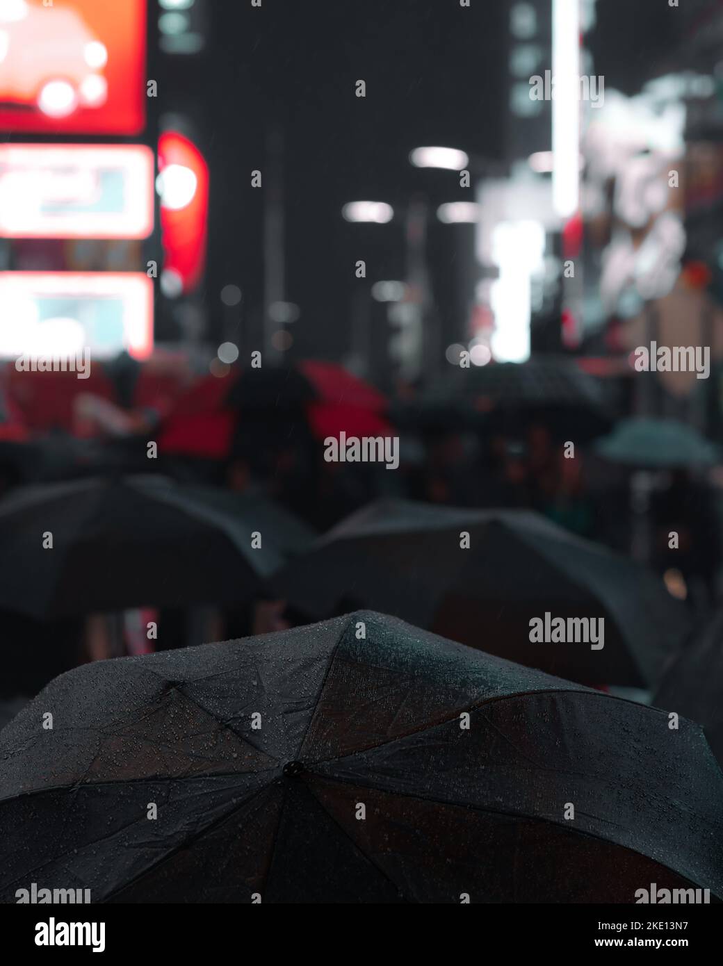 Many many umbrellas photographed from above on a dark night with a lot ...