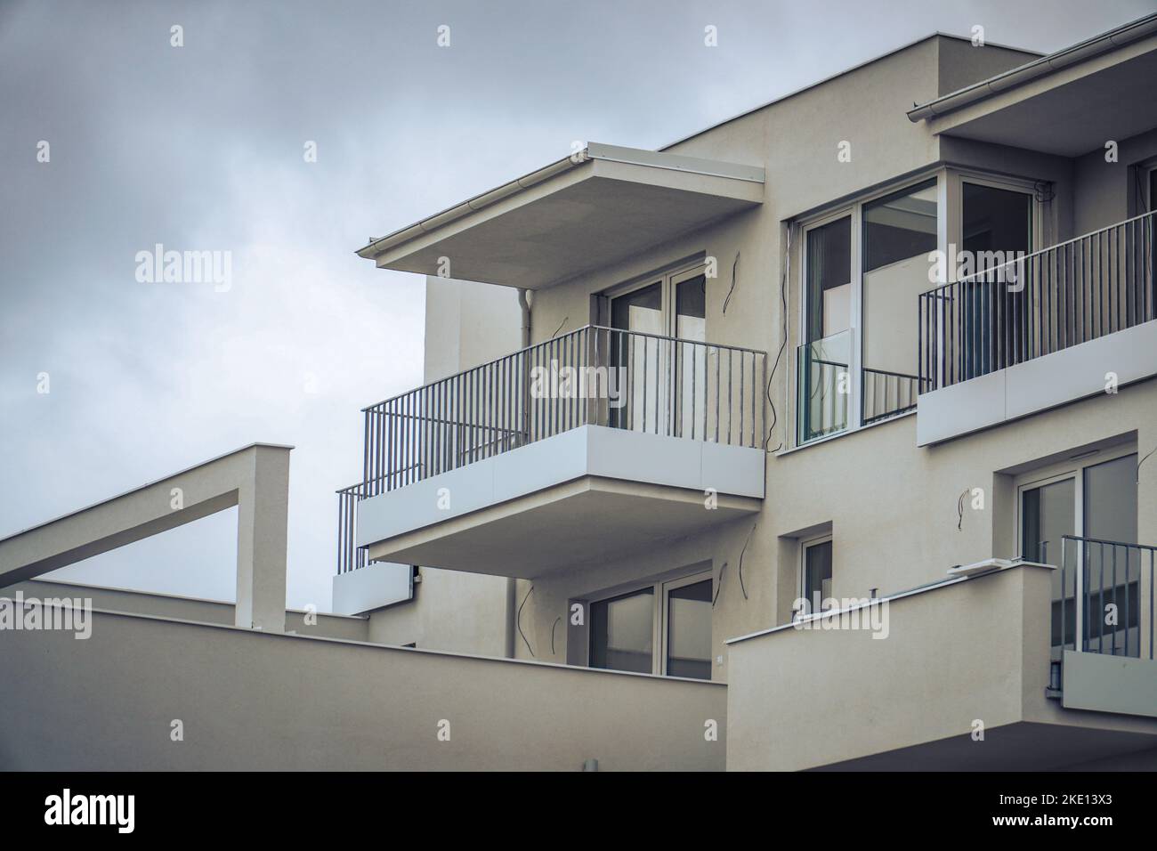 A modern white house with balconies Stock Photo - Alamy
