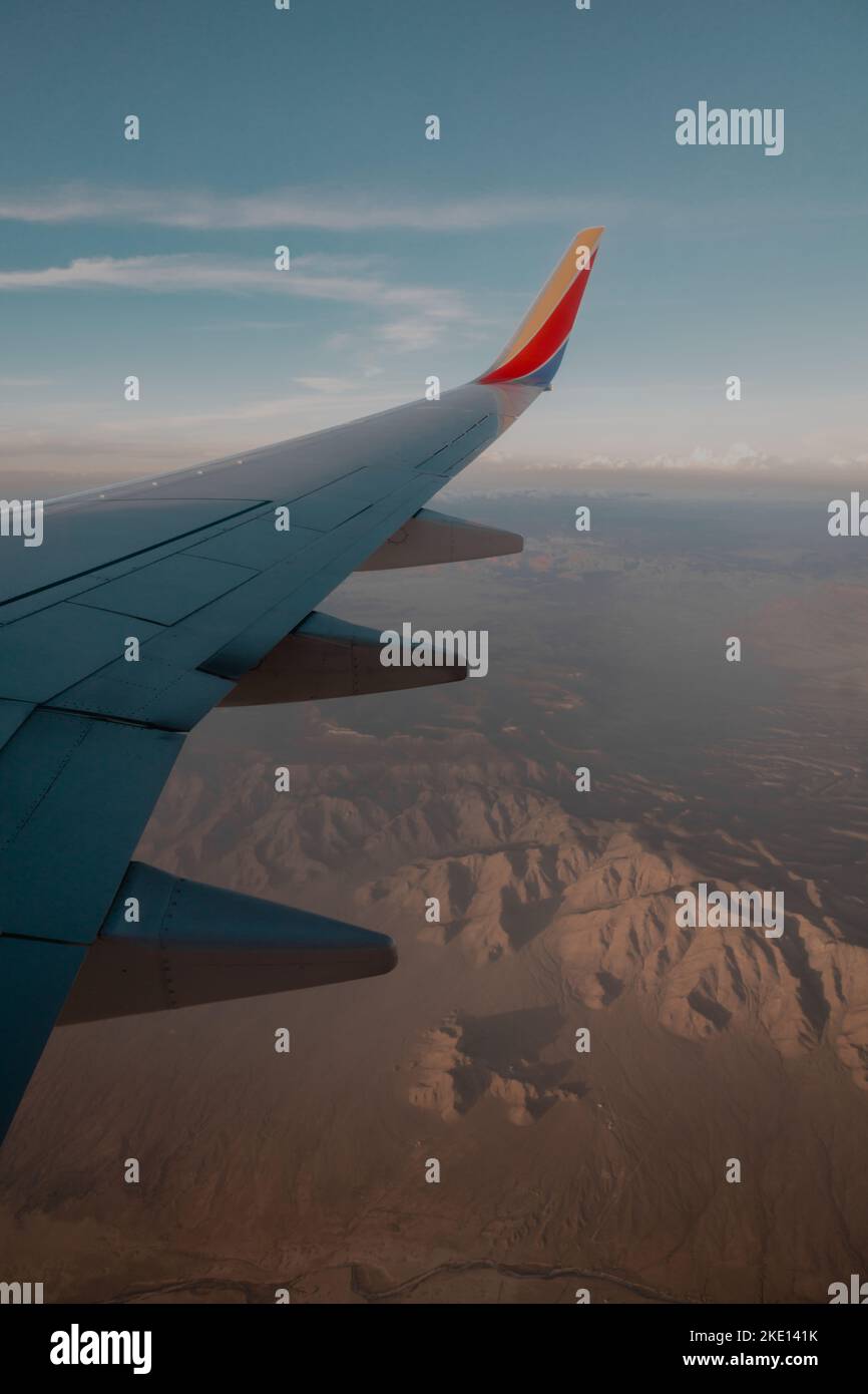 A vertical shot through the airplane window onto the wing flight view ...