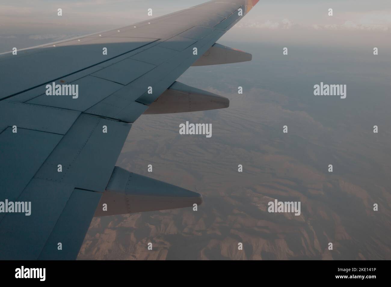 A view of a plane wing from the airplane window Stock Photo - Alamy