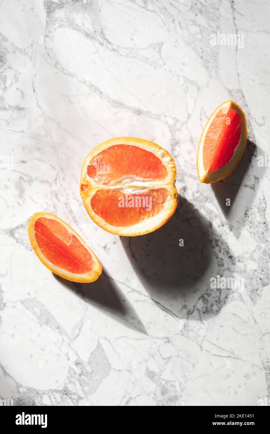 Minimal Red Navel Orange Flat Lay on White Marble Stock Photo - Alamy