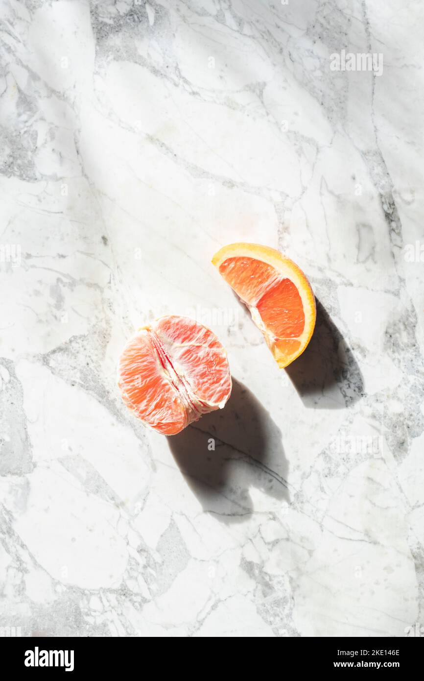 Minimal Red Navel Orange Flat Lay on White Marble Stock Photo - Alamy