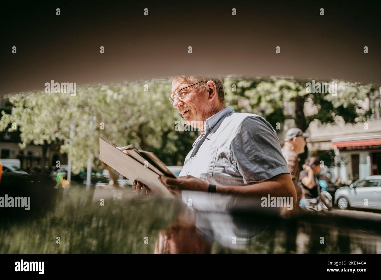 Senior man holding vinyl records at flea market Stock Photo - Alamy