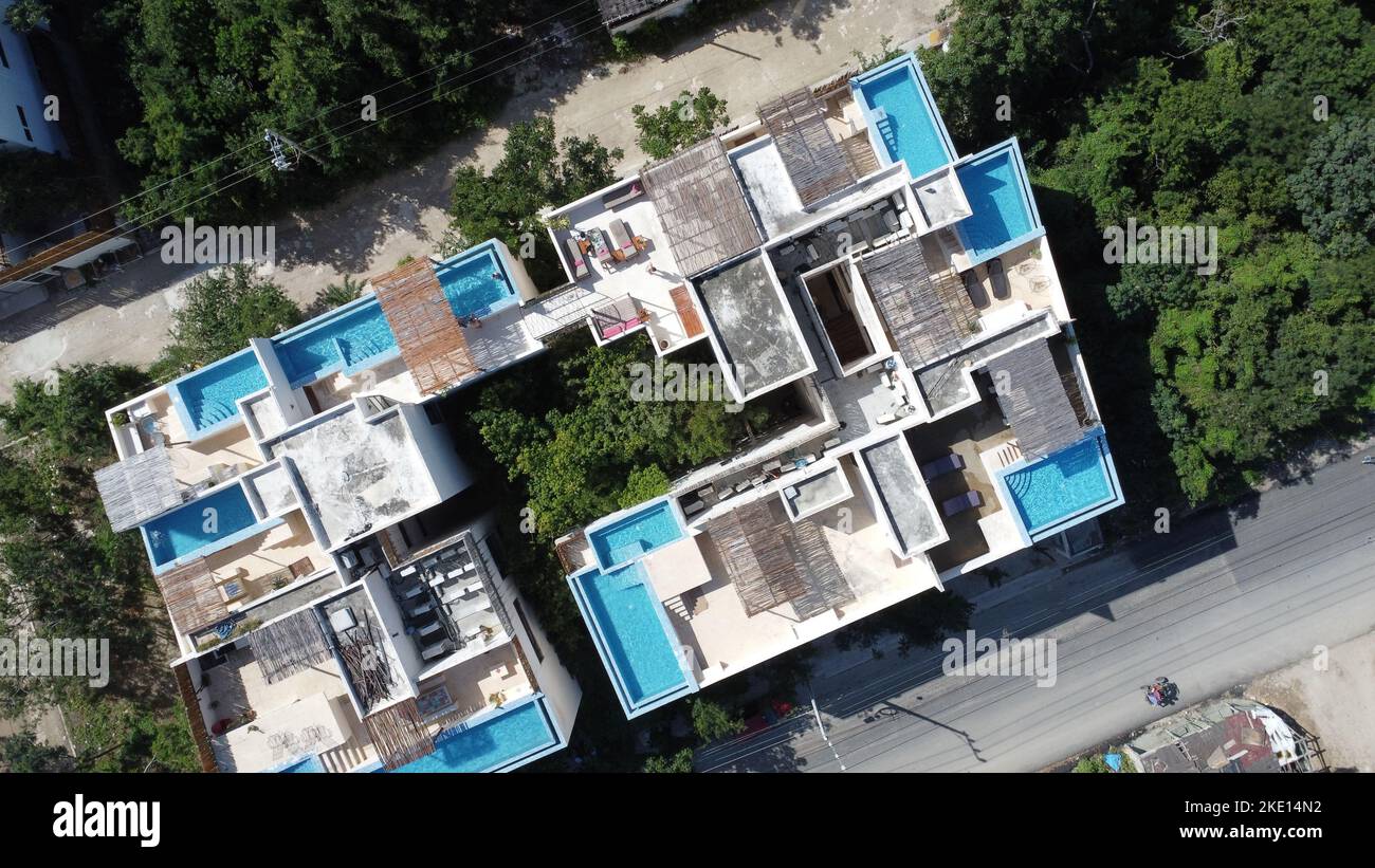 A bird's eye view of a luxury hotel resort with pools on rooftops Stock ...